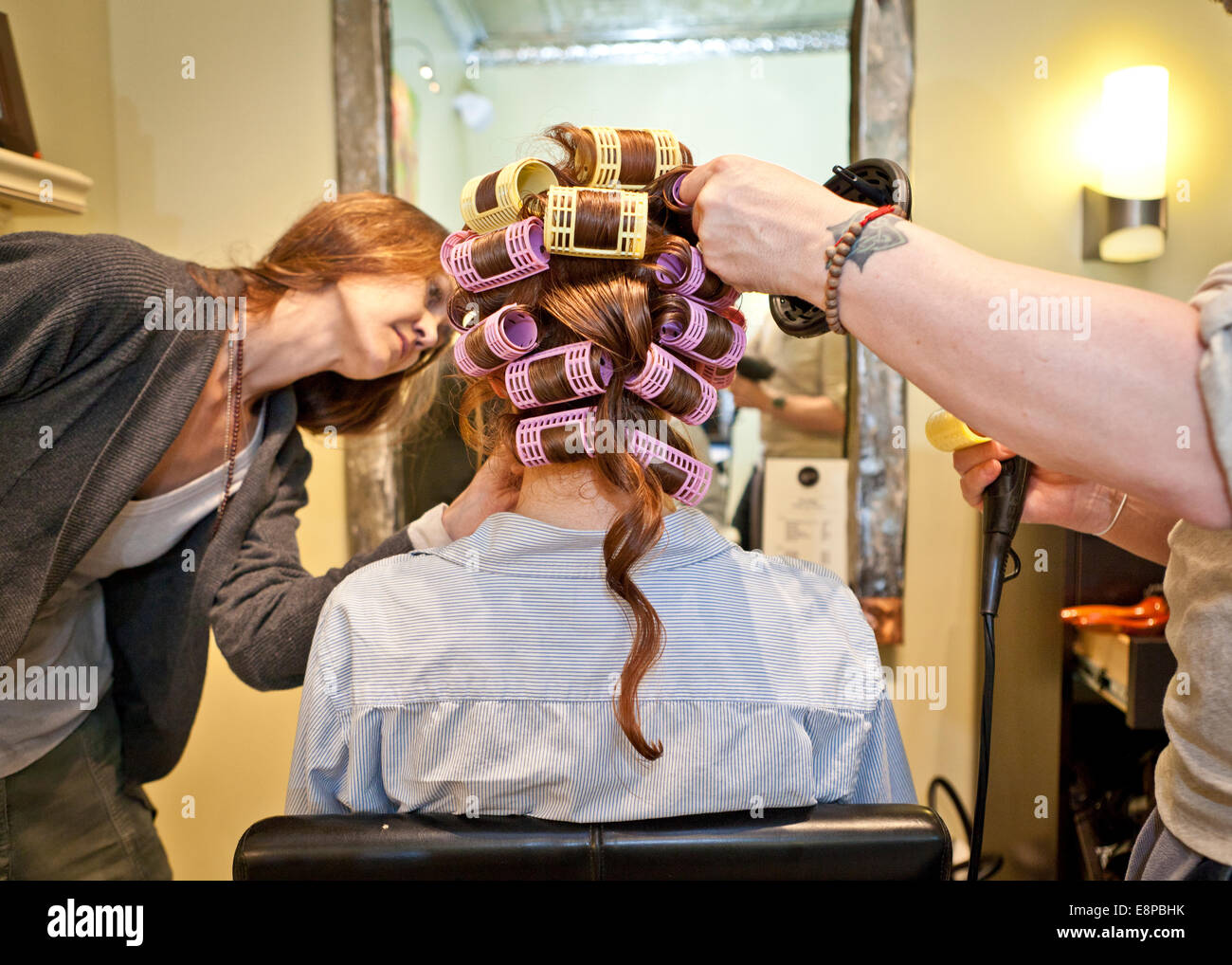 Back view of woman in hair salon Stock Photo - Alamy