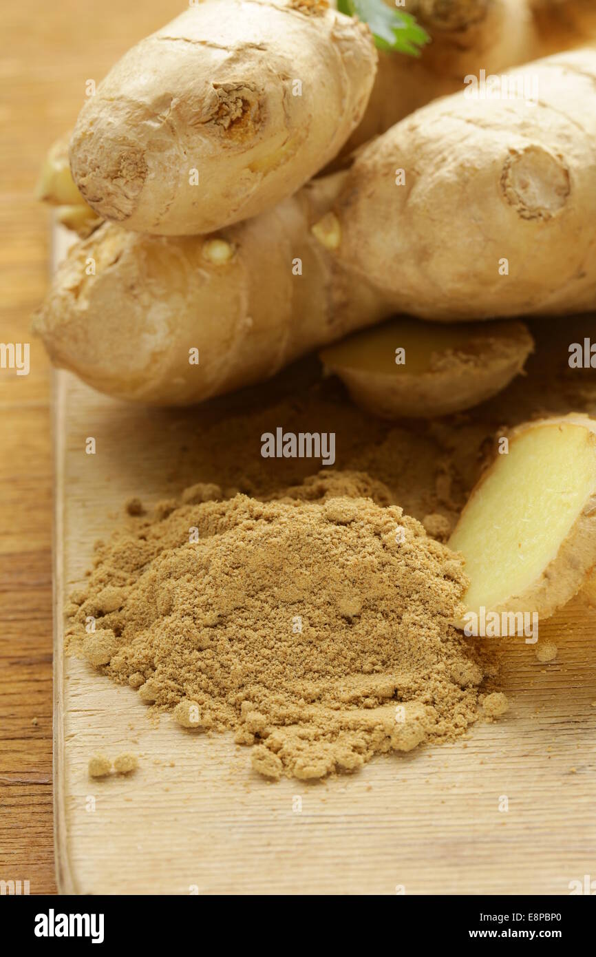ground and fresh ginger traditional oriental spice Stock Photo - Alamy