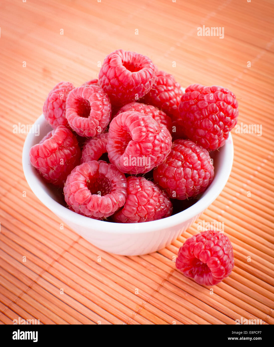 Raspberries in bowl Stock Photo - Alamy