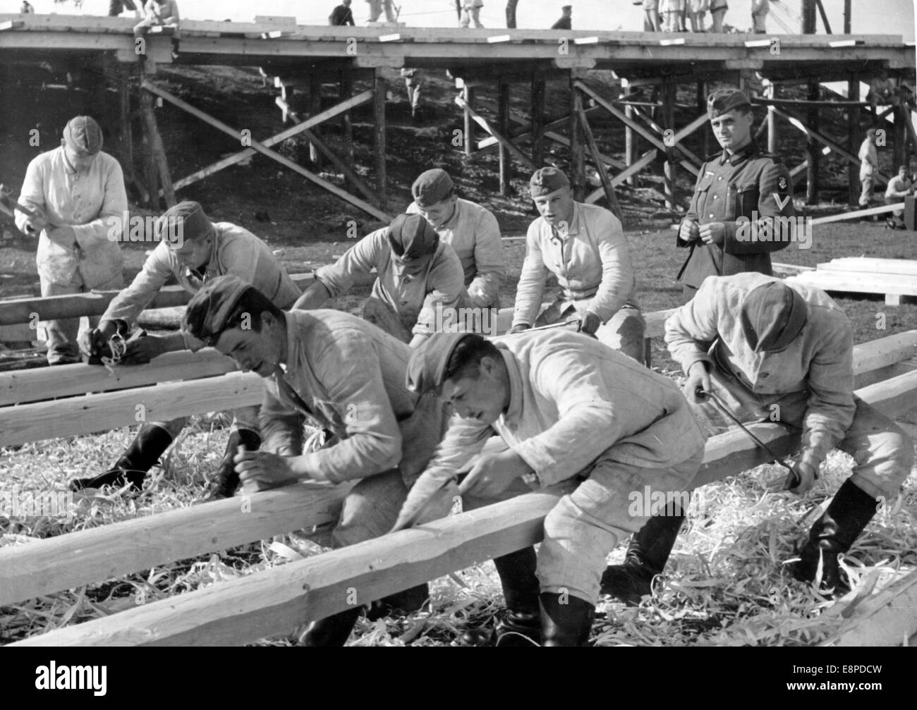 The Nazi propaganda picture shows German Wehrmacht engineers building a ...