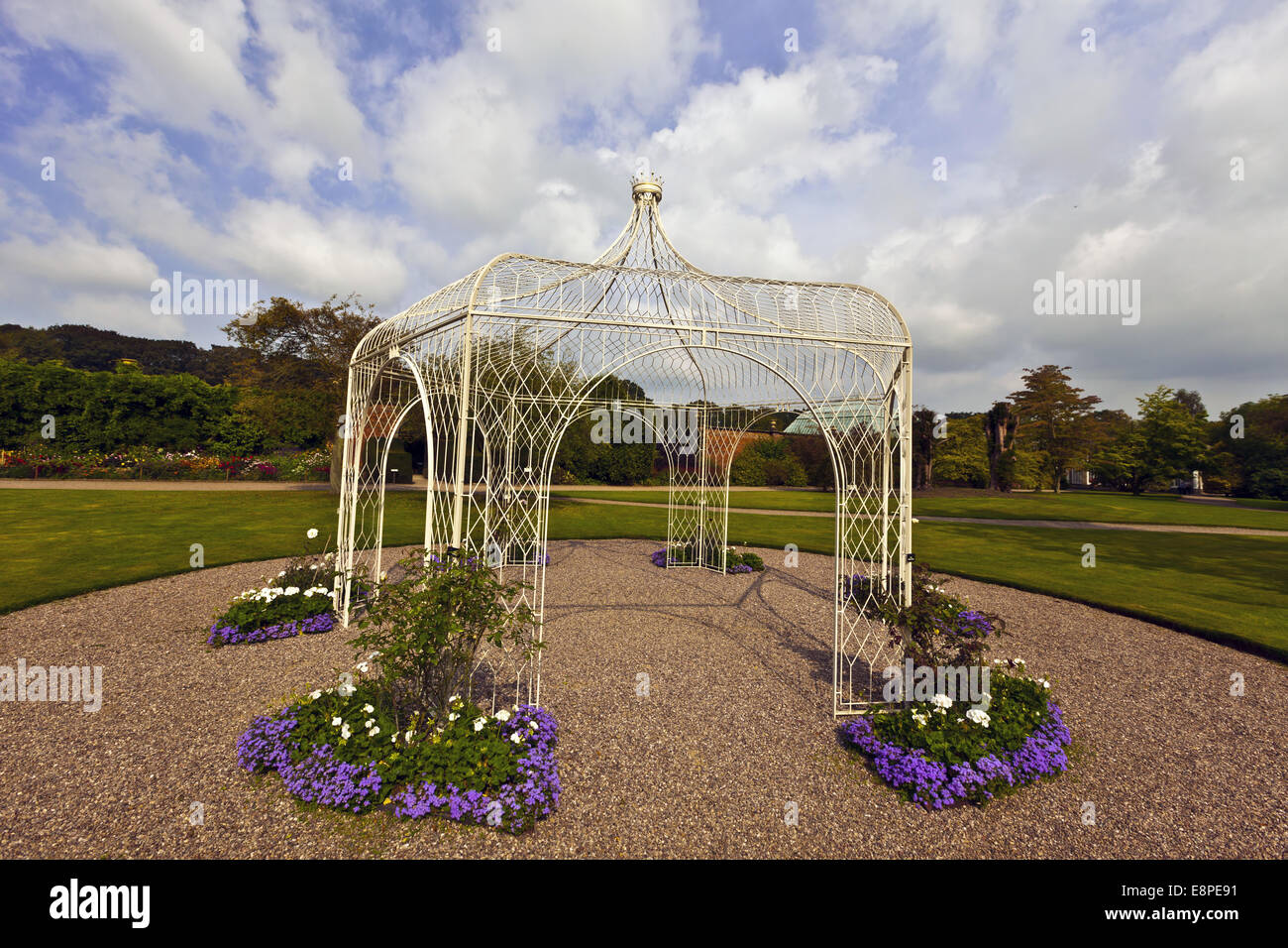 Wrought iron arbor in a landscaped park Stock Photo - Alamy