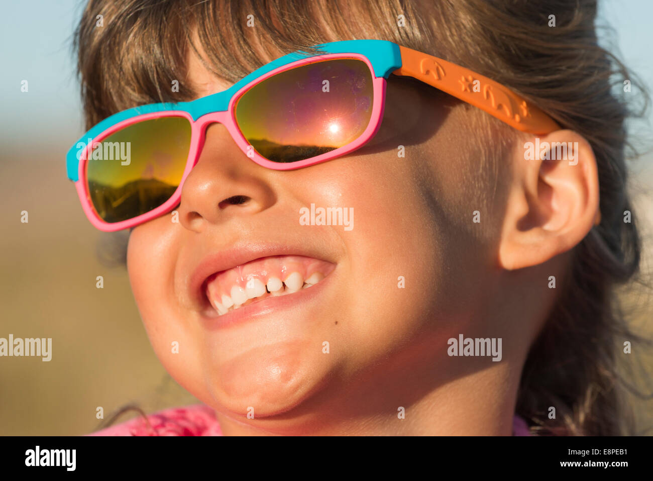 Young girl wearing sunglasses Stock Photo - Alamy