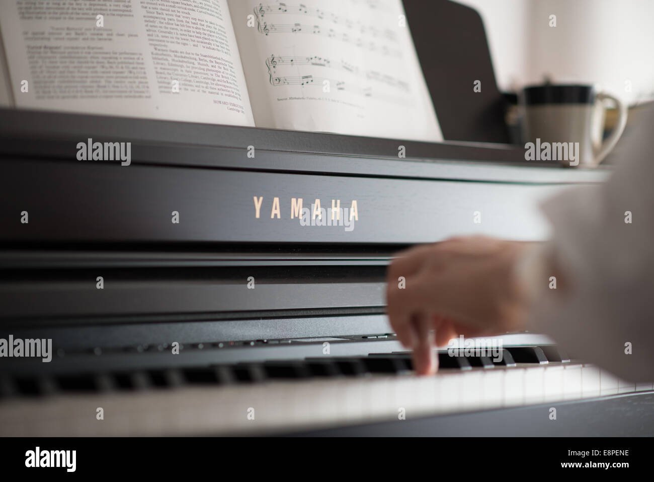 Learning to play Piano Stock Photo - Alamy