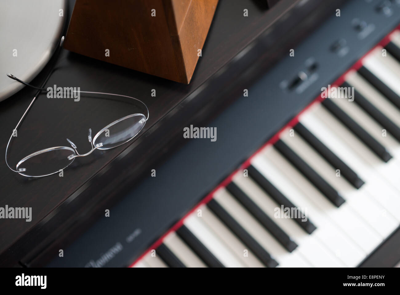 Glasses on Piano - Learn a Musical Instrument - series Stock Photo - Alamy