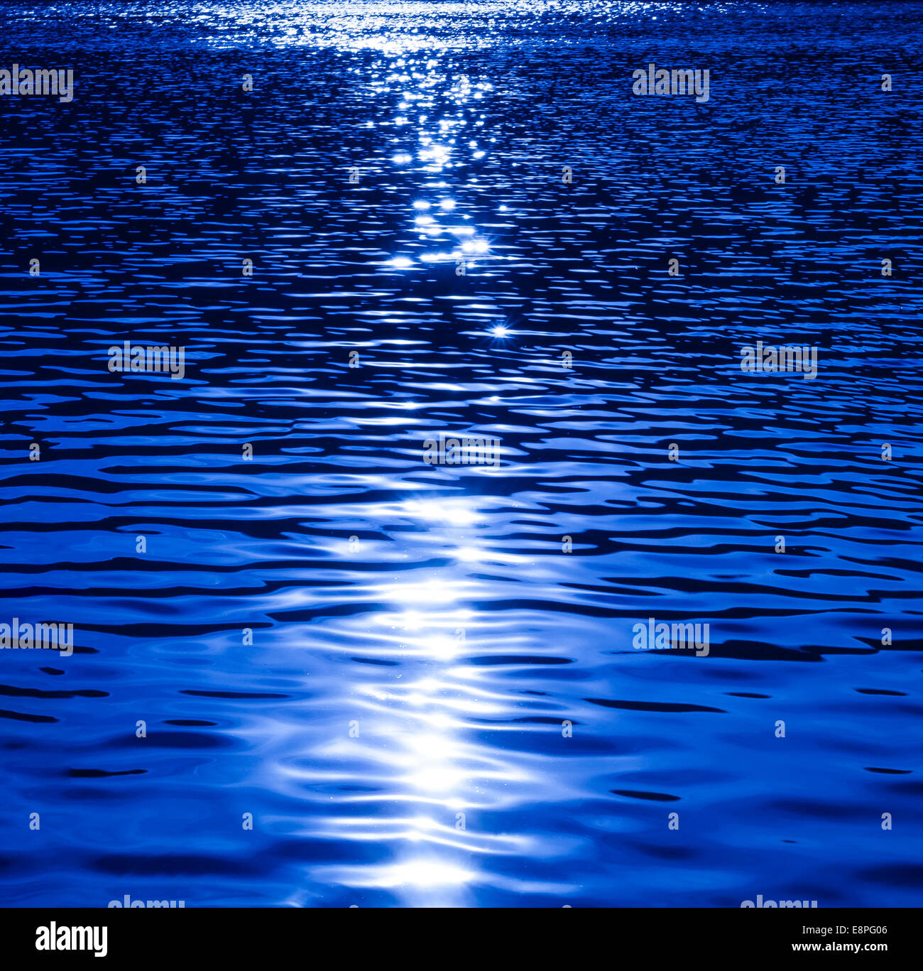 sun reflection on blue water ripples Stock Photo - Alamy