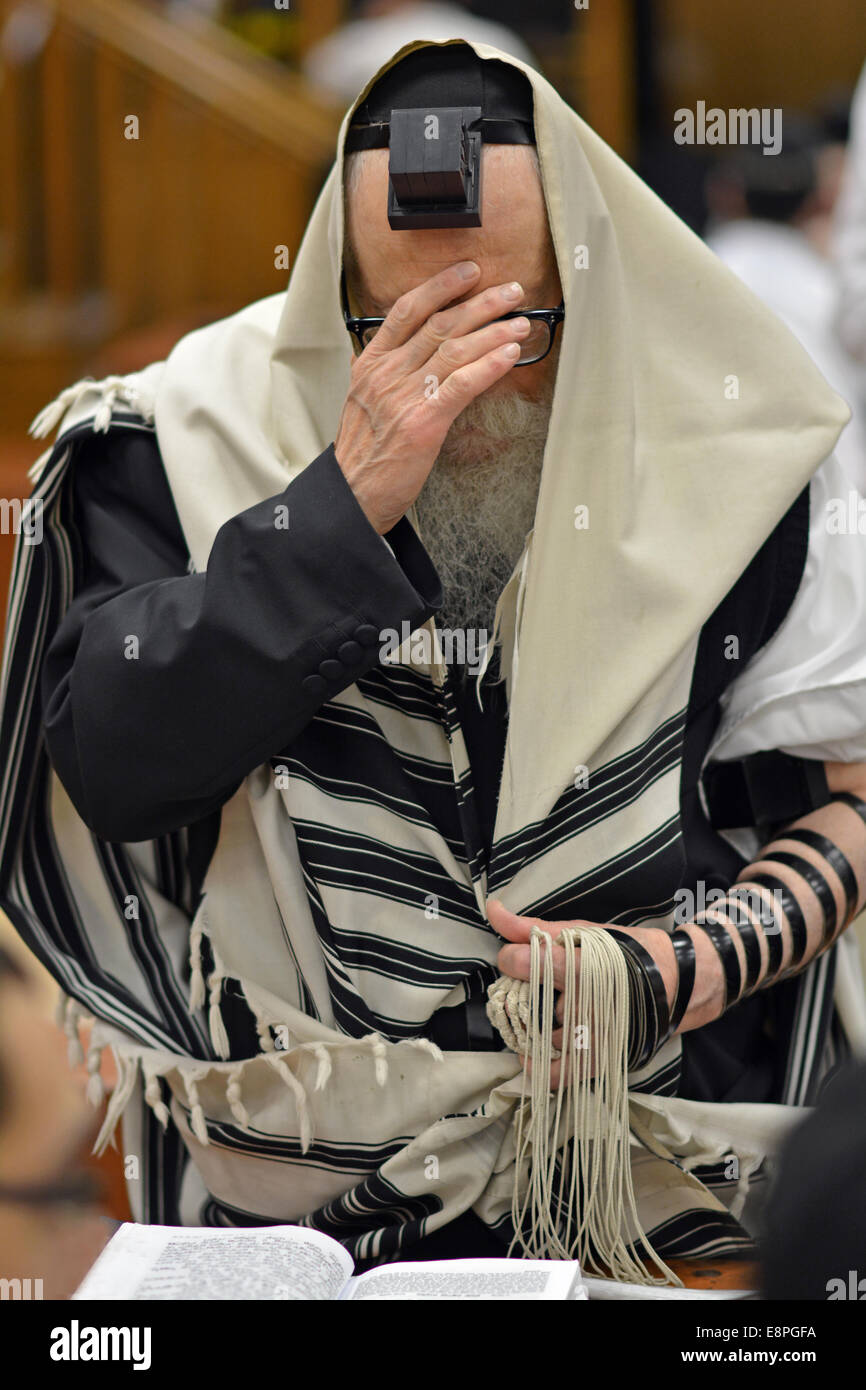 An older Jewish man at morning prayers at a synagogue in Crown Heights ...