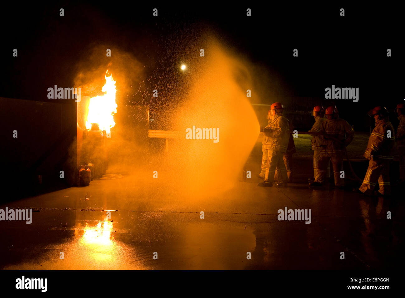 firefighters attack a gas fire Stock Photo - Alamy