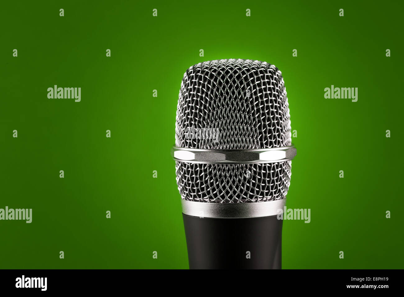 Wireless microphone closeup on green background Stock Photo - Alamy
