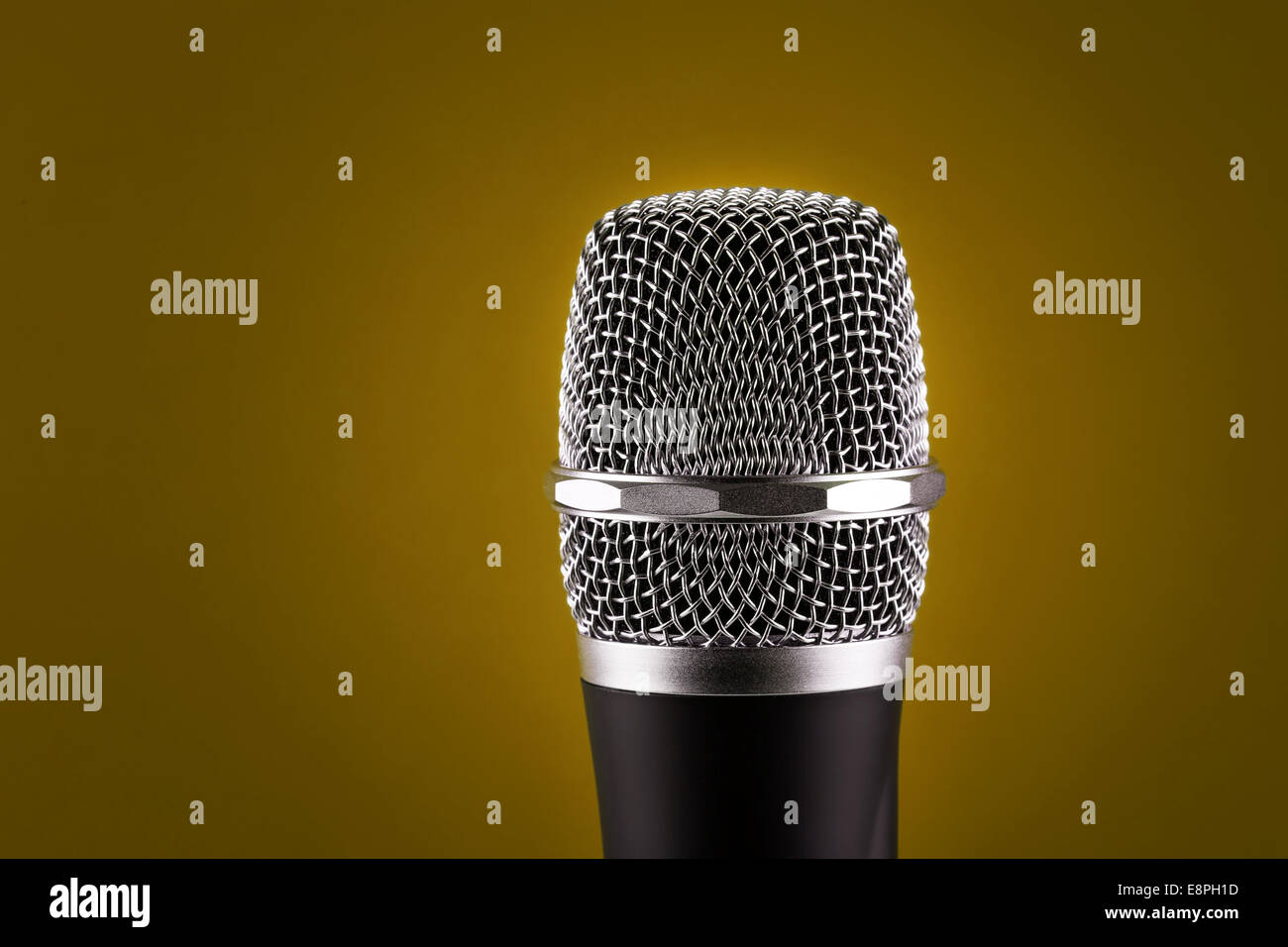 Wireless microphone closeup on yellow background Stock Photo - Alamy
