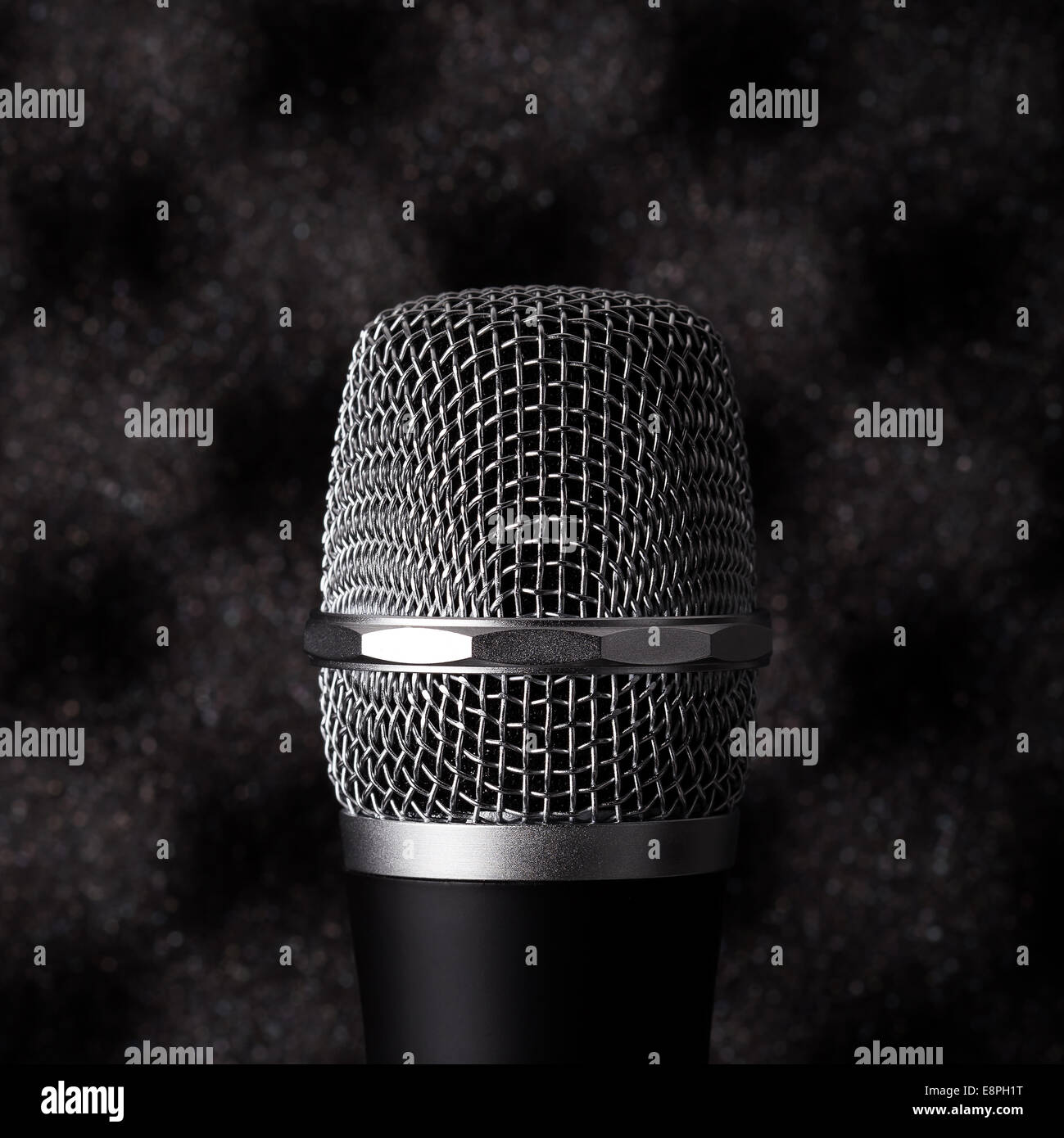 Wireless microphone closeup on foam rubber acoustic treatment ...