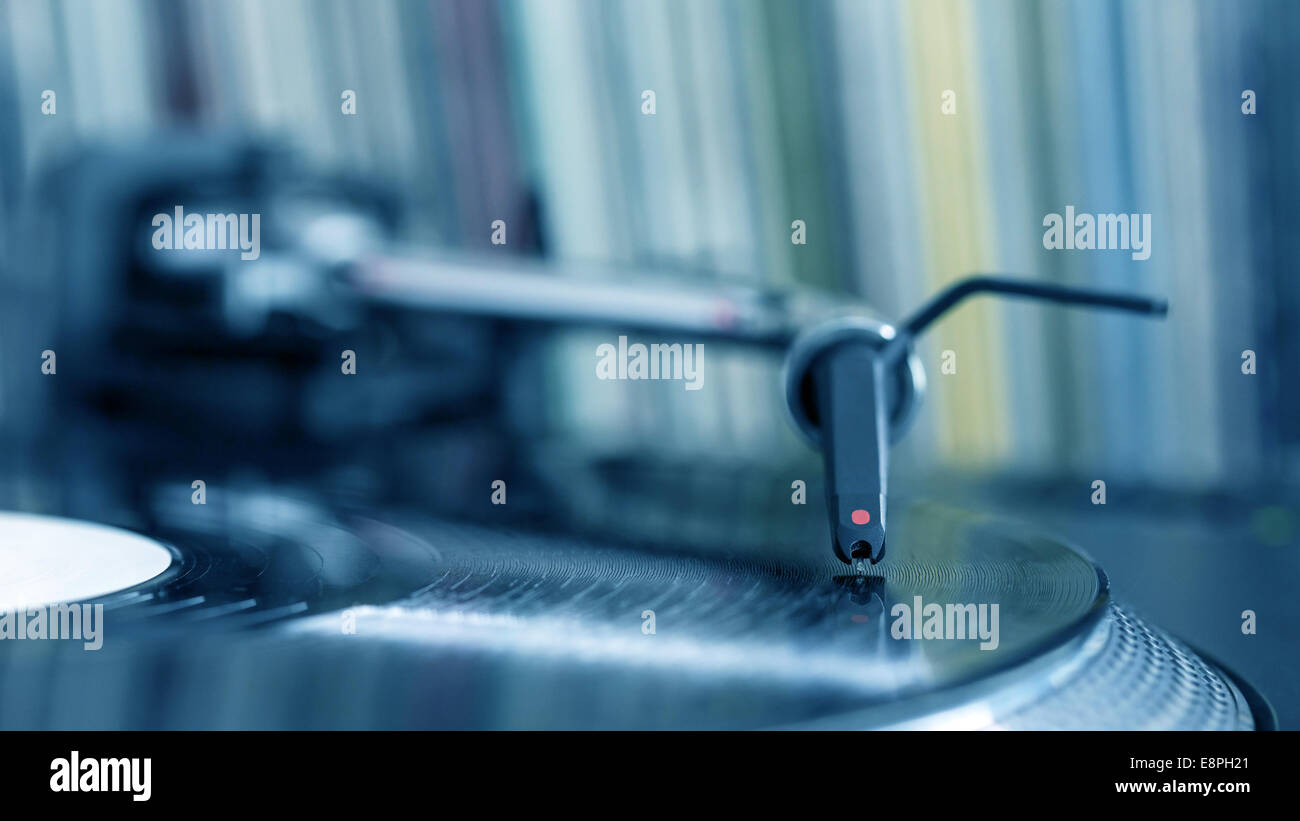 Dj needle stylus on spinning record, vinyl background Stock Photo - Alamy