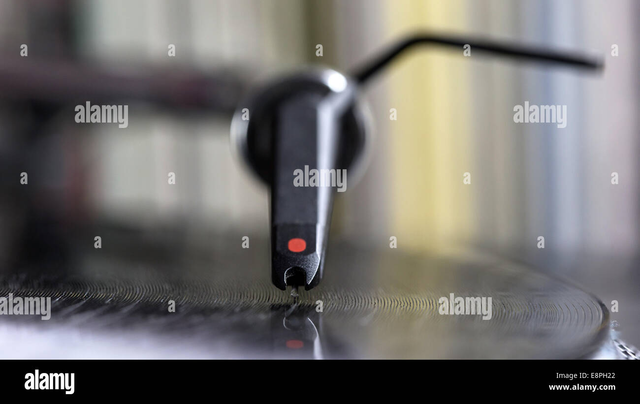 Dj needle stylus on spinning record, vinyl background Stock Photo - Alamy