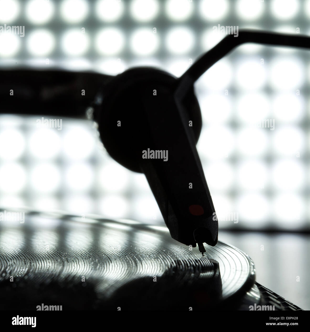 Dj needle stylus on spinning record, blur light background Stock Photo ...