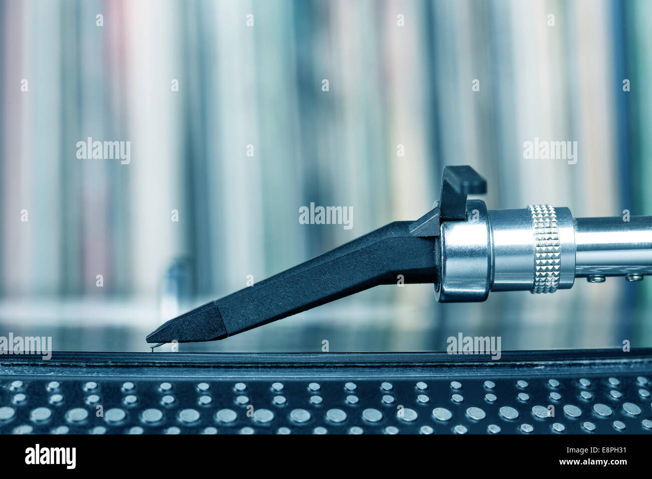 Dj needle stylus on spinning record, vinyl background Stock Photo - Alamy