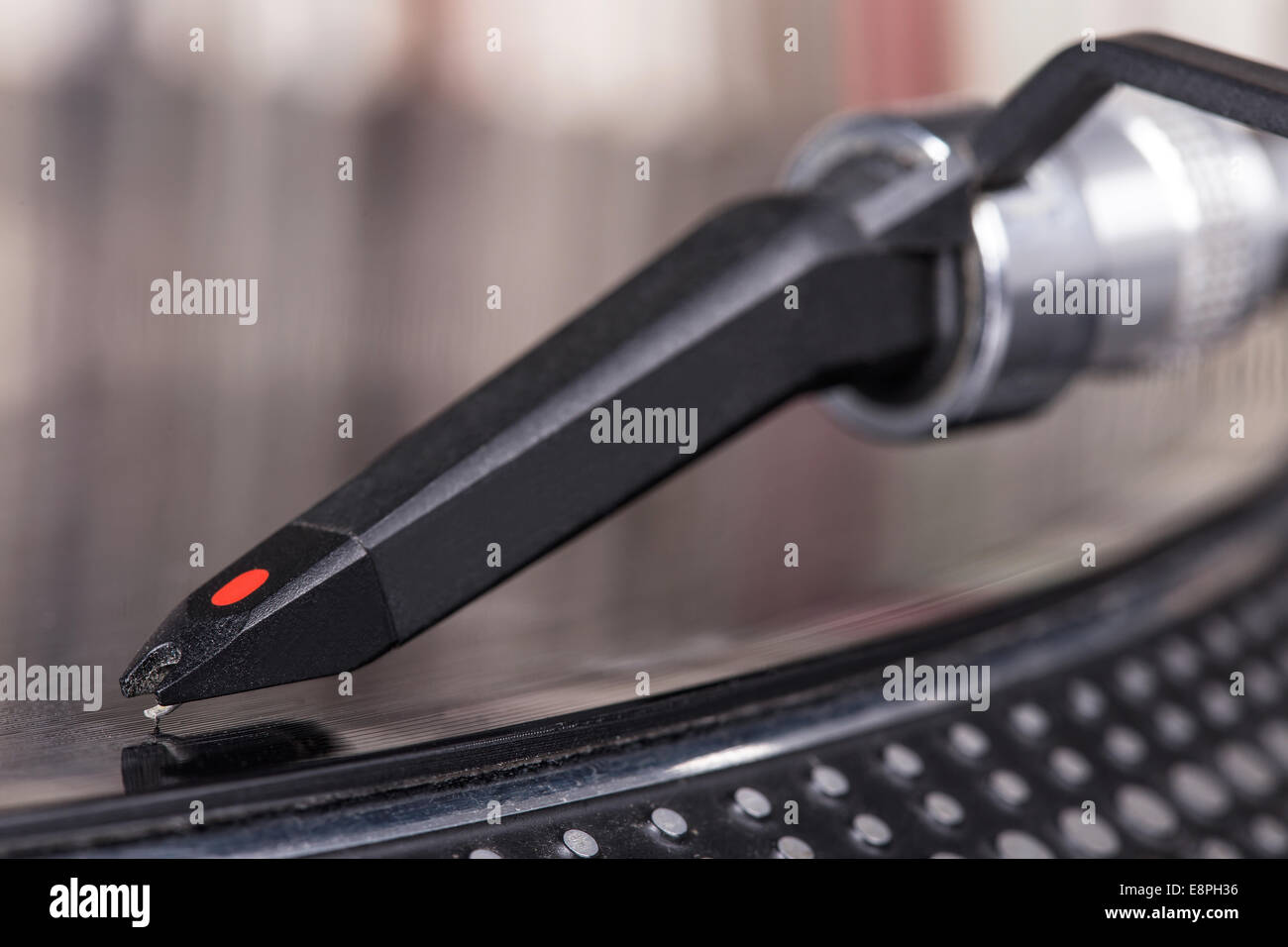 Dj needle stylus on spinning record, vinyl background Stock Photo - Alamy