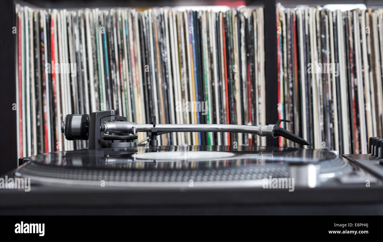 Dj turntable on vinyl background, closeup Stock Photo - Alamy