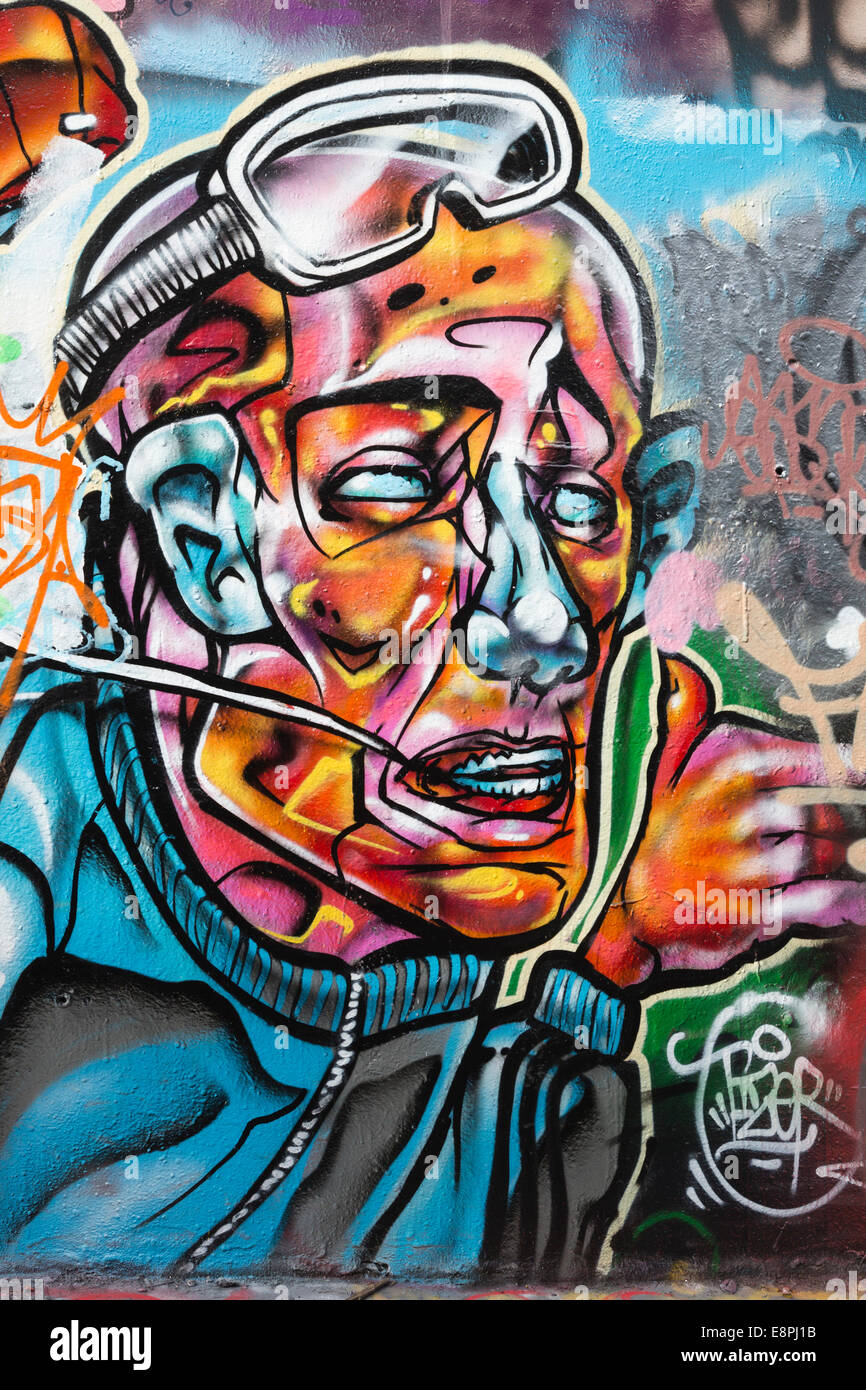 Graffiti of a male face with a mask, Leake Street, London, England ...