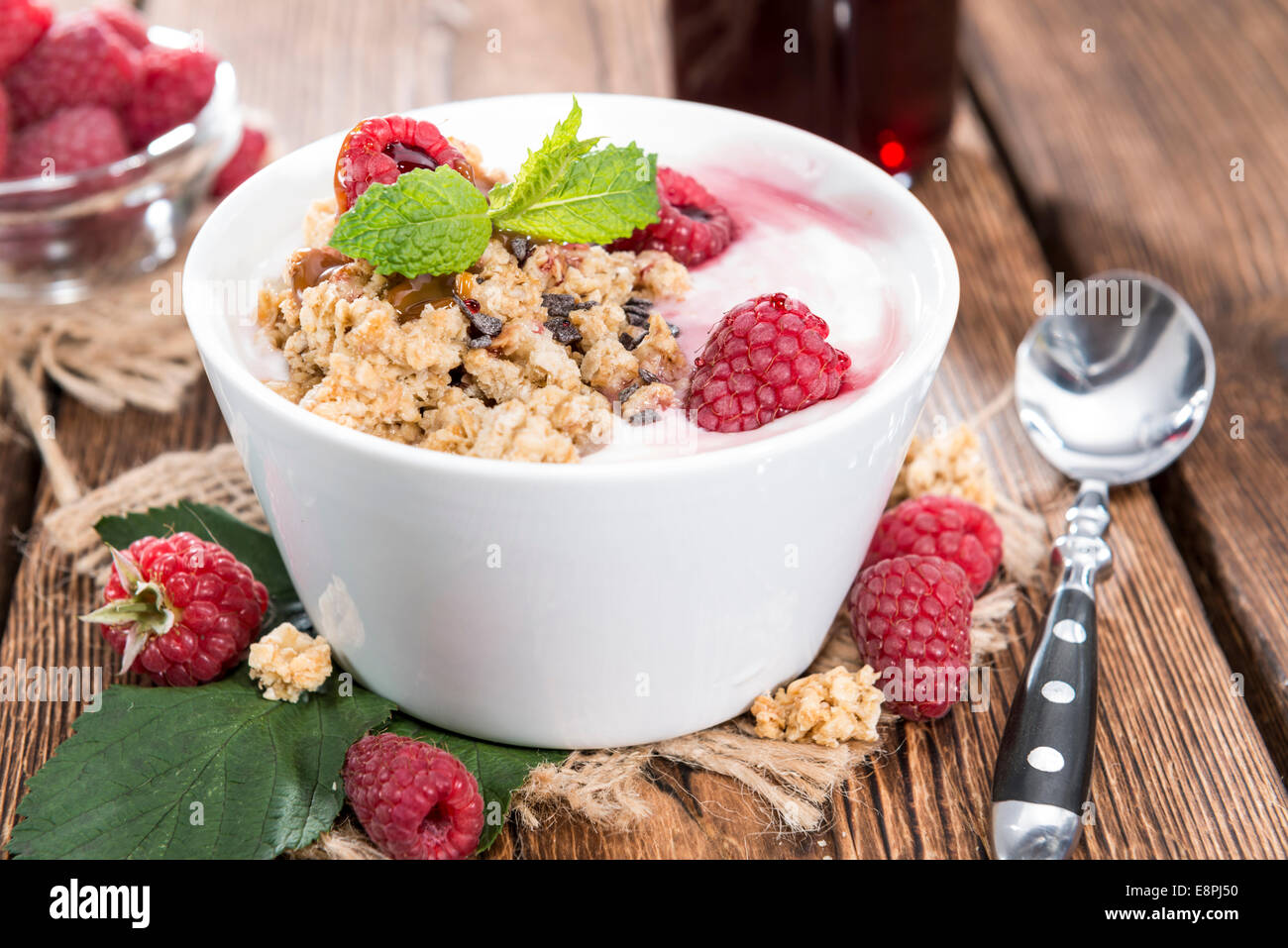 Bowl with fresh made Raspberry Yogurt and some fruits Stock Photo - Alamy