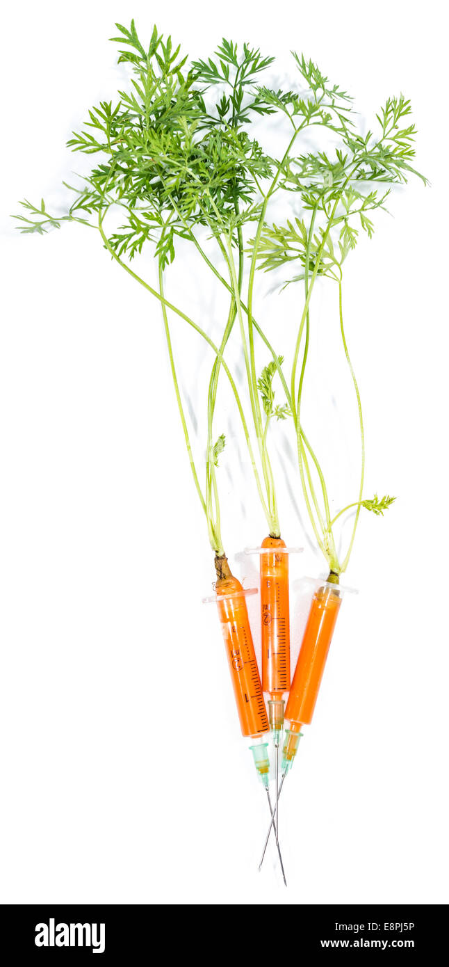 Carrot Injection (with green) isolated on white background Stock Photo ...