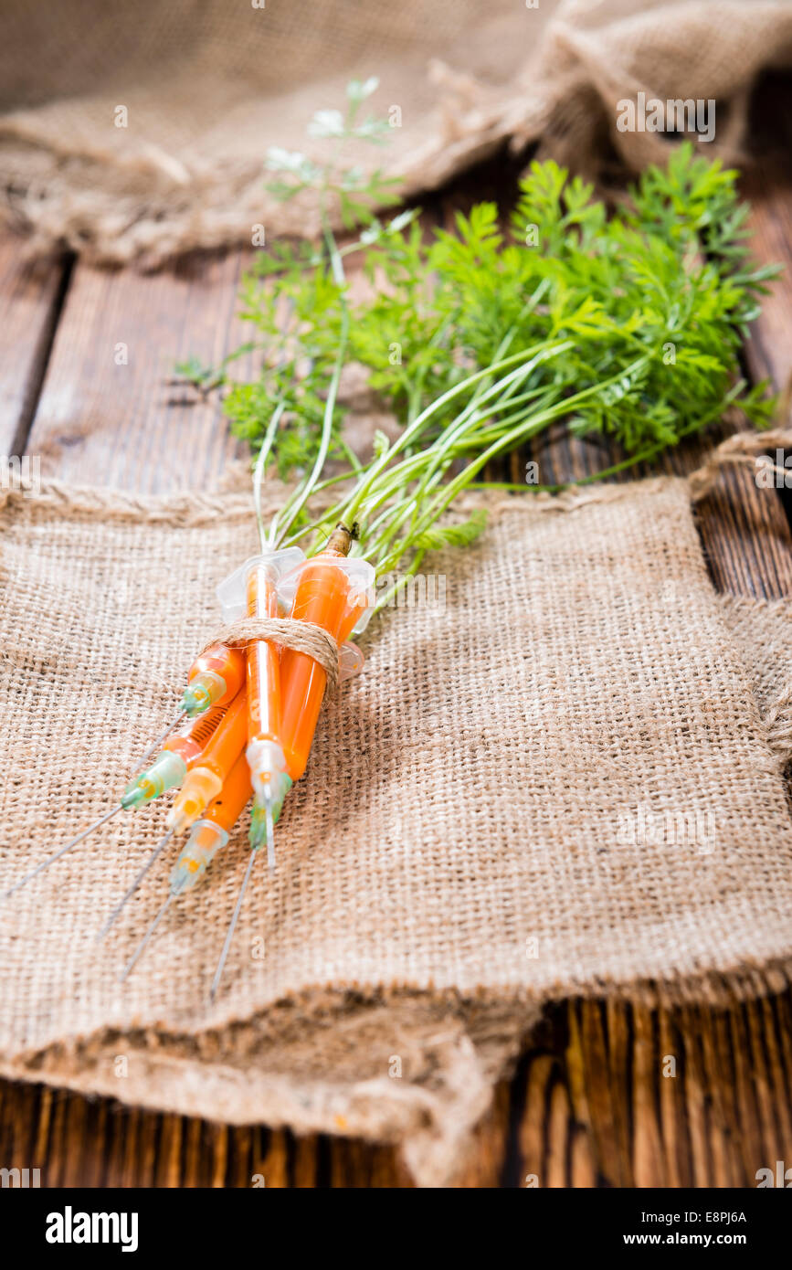 Carrot Juice Injections (on rustic wooden background Stock Photo - Alamy