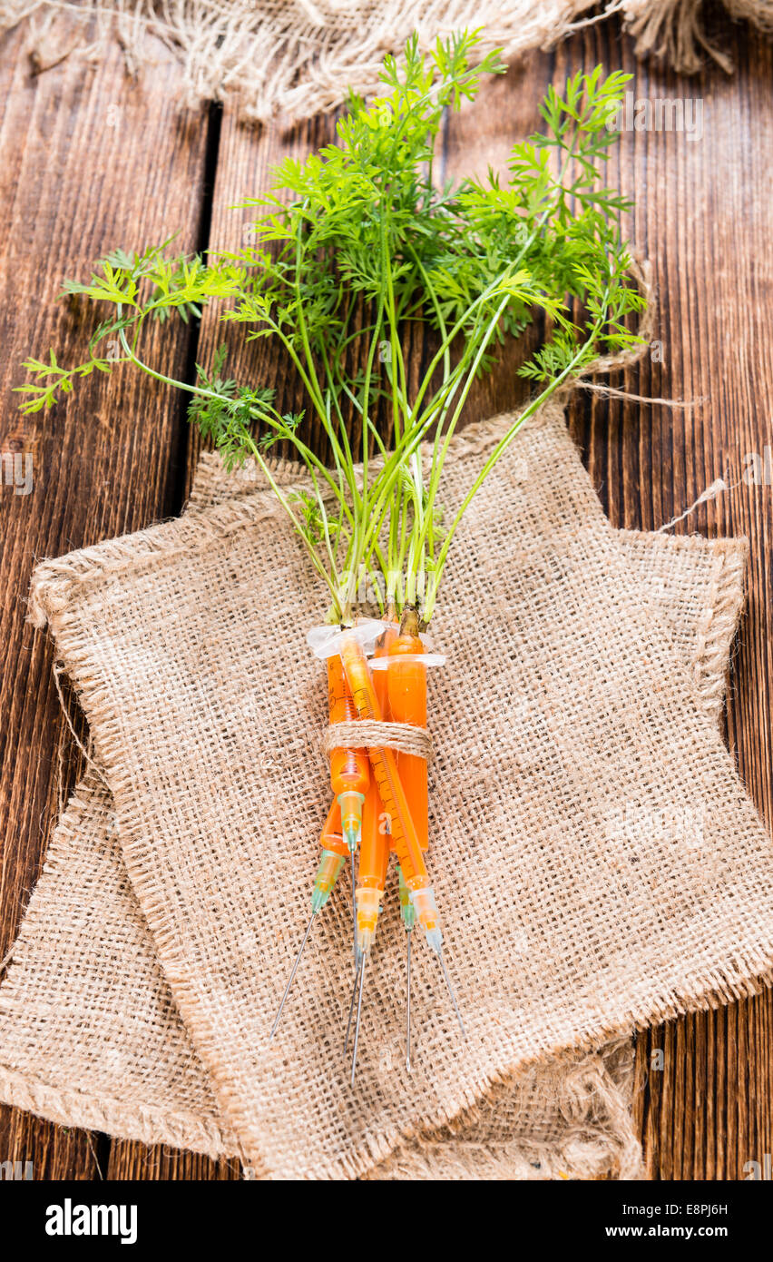 Carrot Juice Injections (on rustic wooden background Stock Photo - Alamy