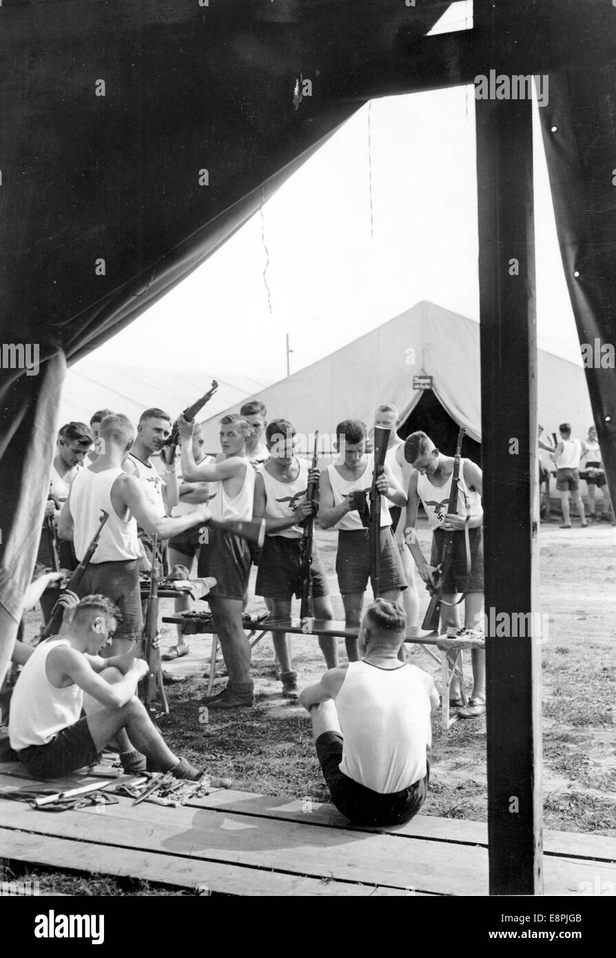 Nuremberg Rally 1937 in Nuremberg, Germany - Cleaning guns in front of ...
