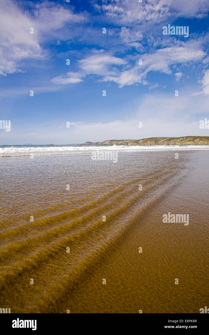 Ripples in the shallow surf at Newgale beach, Pembrokeshire, West Wales ...