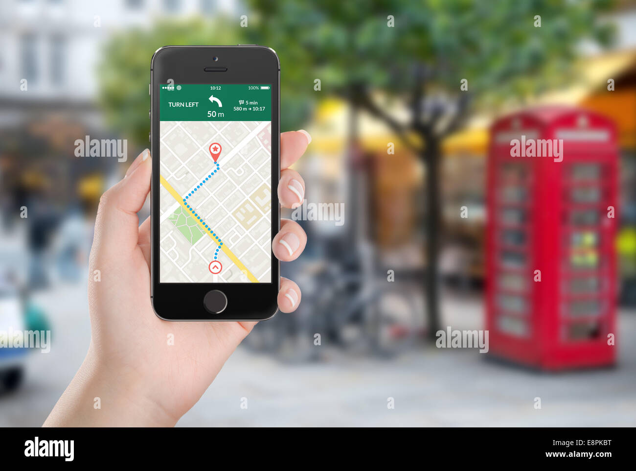 Female hand holding black mobile smart phone with map gps navigation application with planned ...