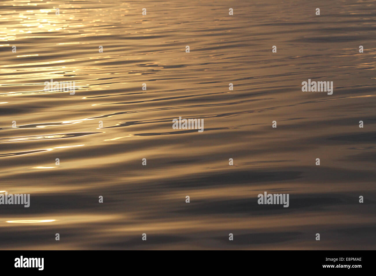 abstract water surface at sunrise Stock Photo - Alamy