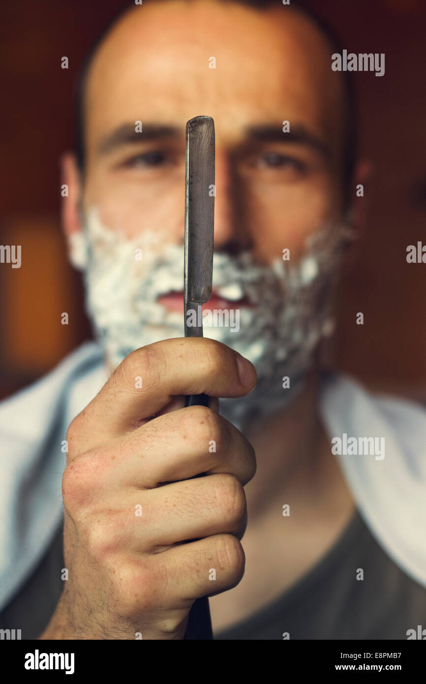 Young man getting old fashioned shave hi-res stock photography and ...