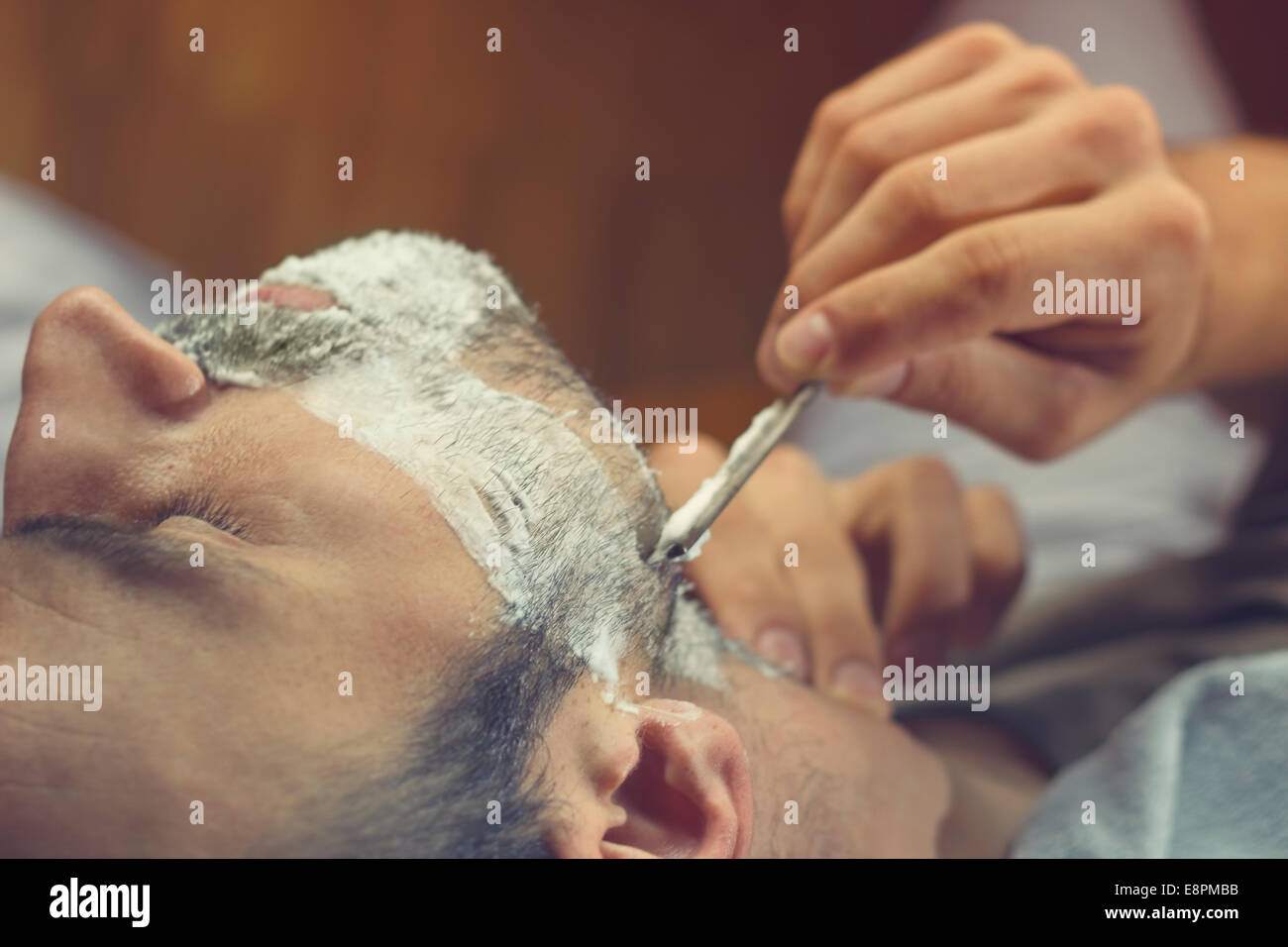 Young man getting old fashioned shave hi-res stock photography and ...