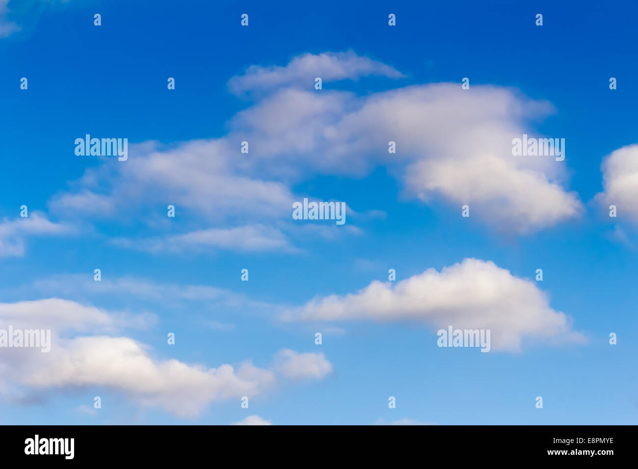 White fluffy clouds float on the blue sky in a clear sunny day Stock ...