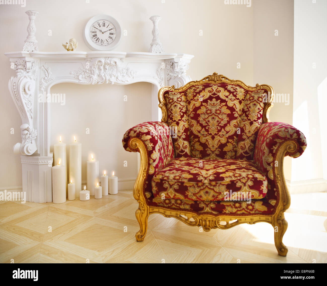 Luxurious vintage red and gold armchair Stock Photo - Alamy