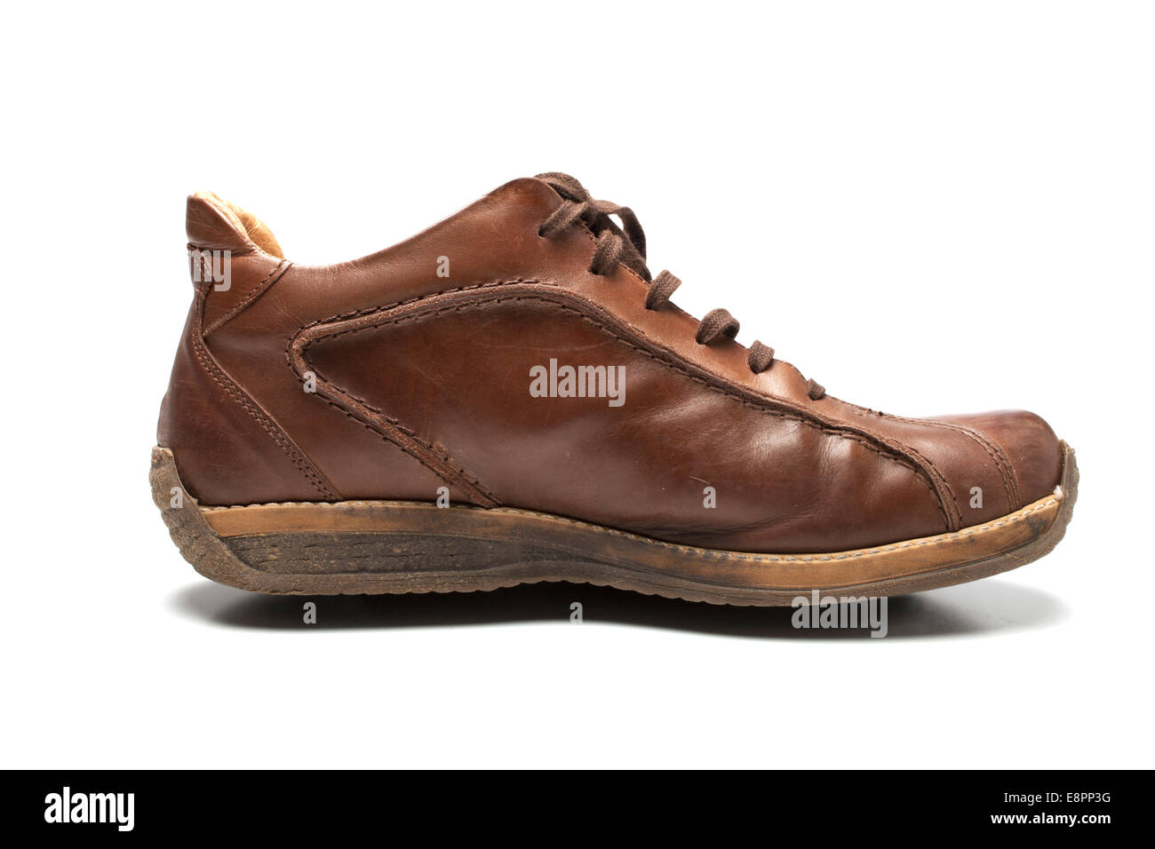 an old brown shoe isolated in a white background Stock Photo - Alamy