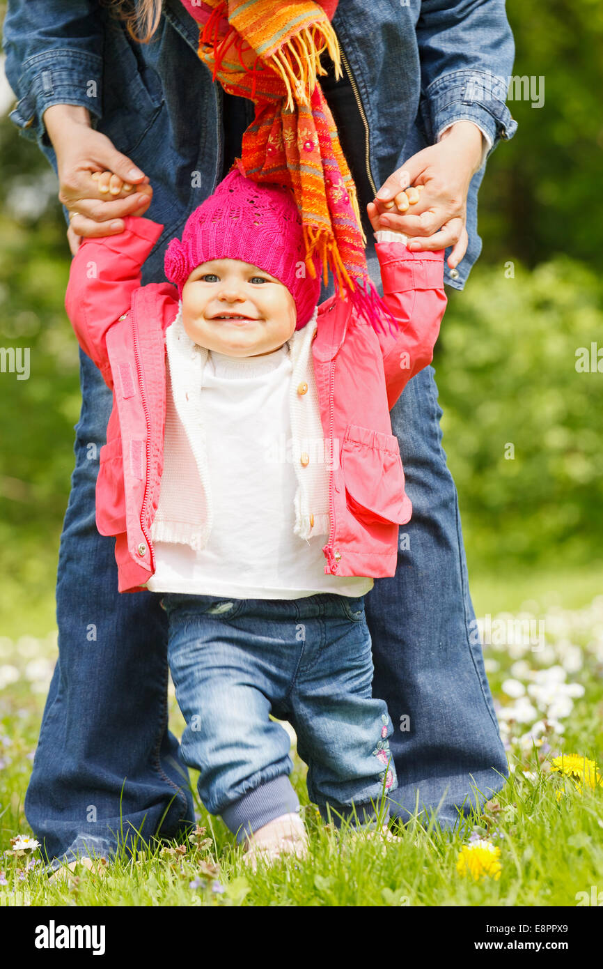 Baby's first steps Stock Photo - Alamy