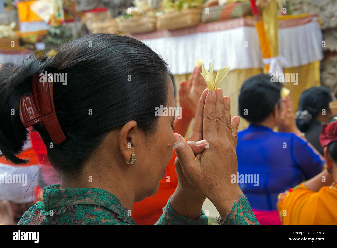 Woman praying in temple Ubud Bali Indonesia Stock Photo - Alamy