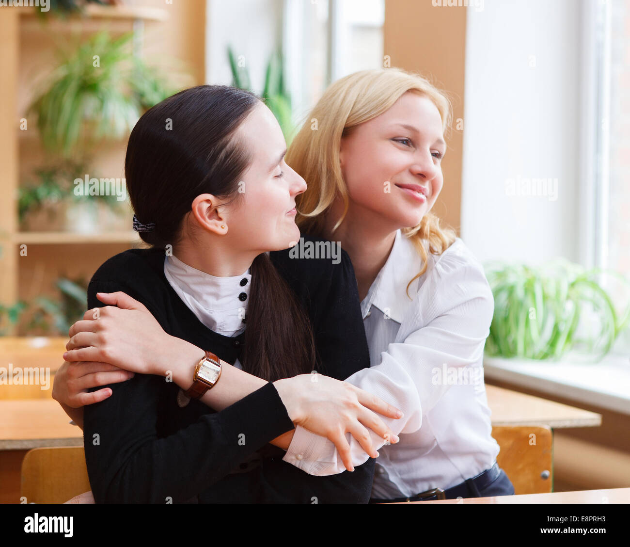 Between two girl school team hi-res stock photography and images - Alamy