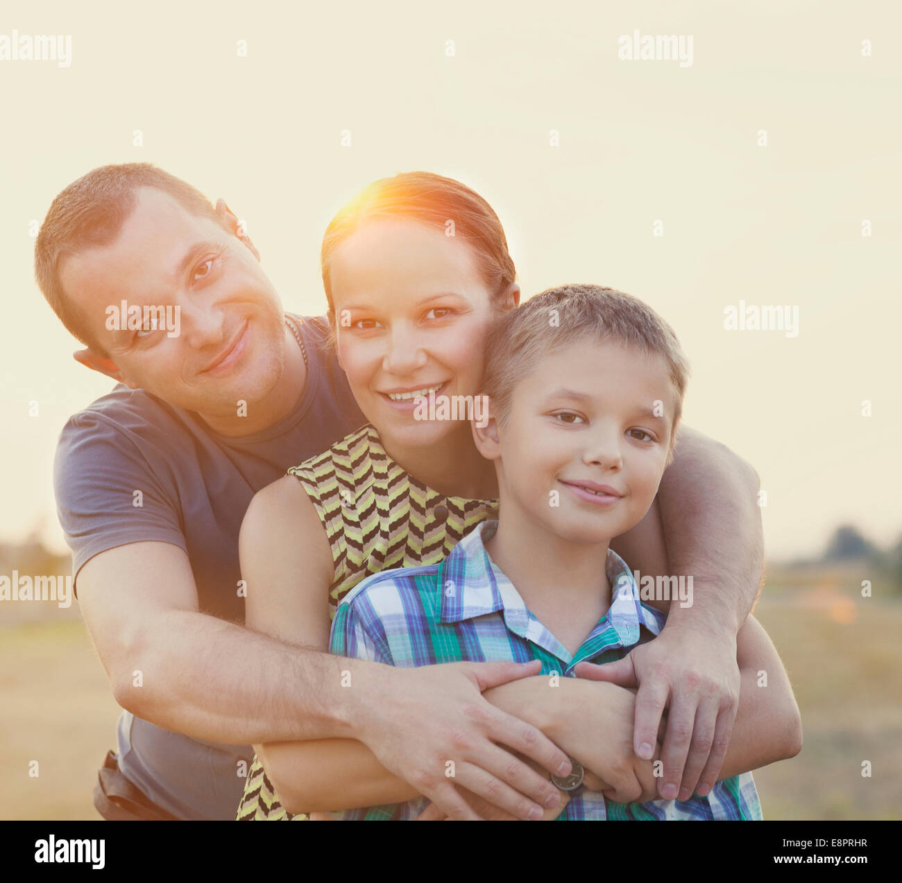 Happy young family with little son outdoors Stock Photo - Alamy