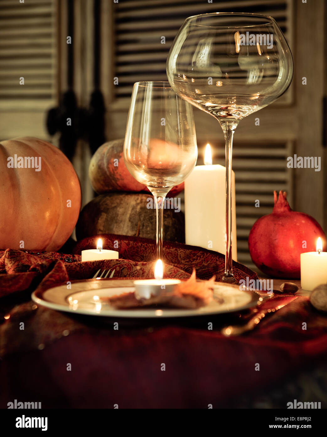 Autumn place setting. Thanksgiving dinner. Fall season fruit, pumpkins ...