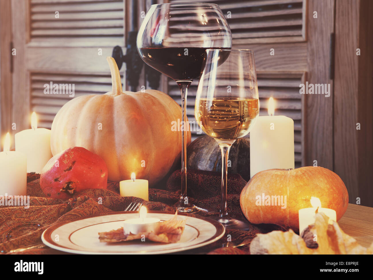 Autumn place setting. Thanksgiving dinner. Fall season fruit, pumpkins ...
