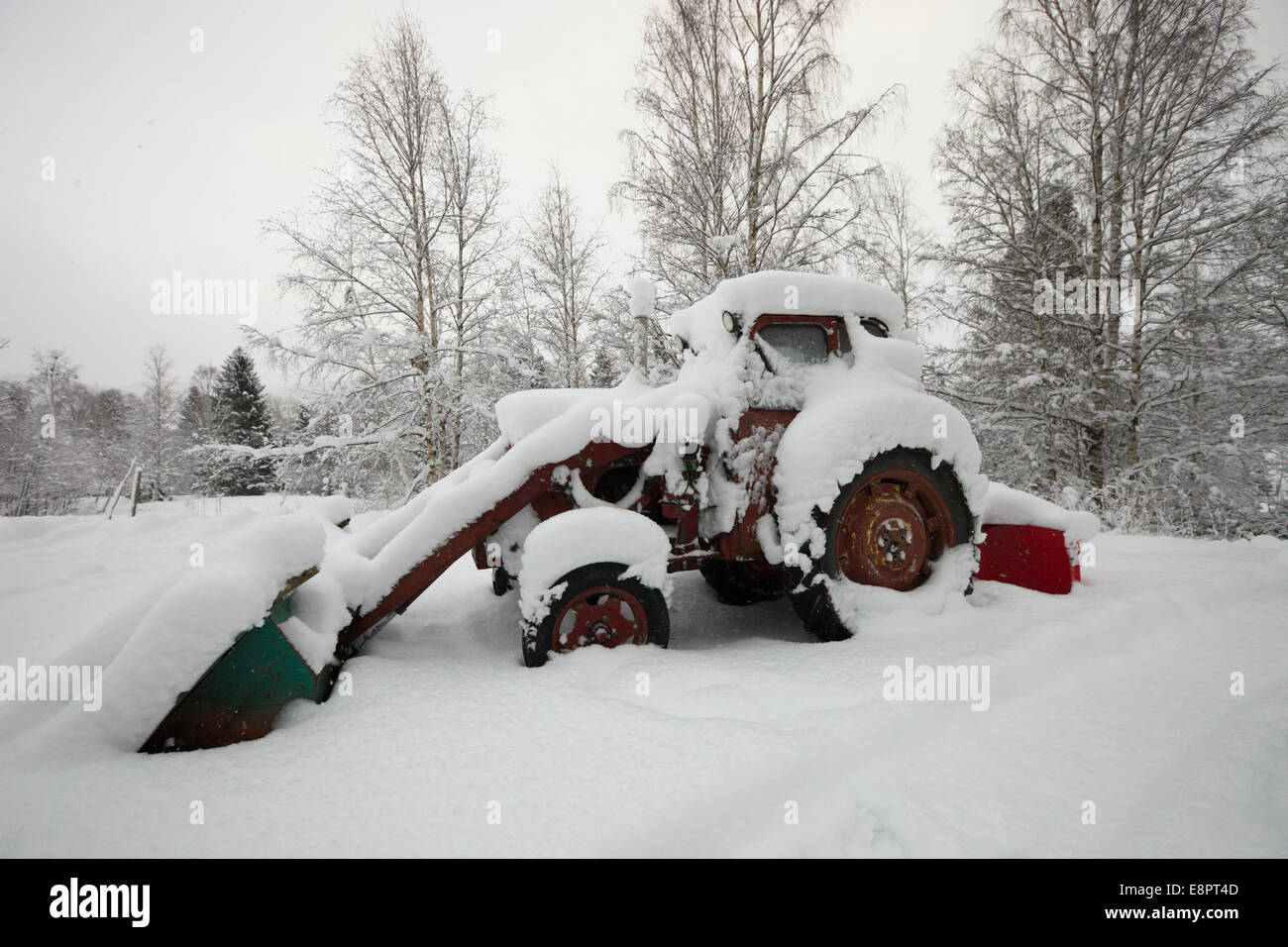 A vintage David Brown tractor with loader and shovel for snow plowing ...