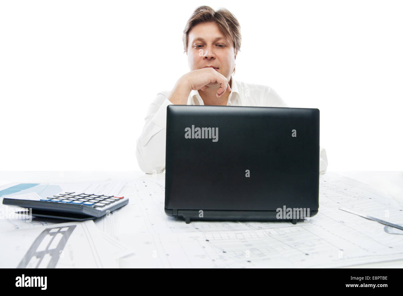 Thinking young office worker with laptop isolated Stock Photo - Alamy