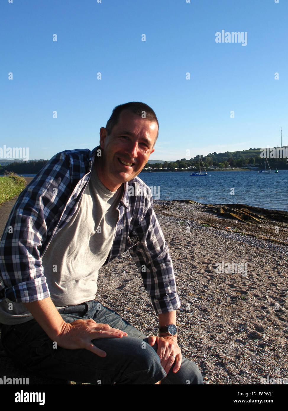 Man sitting in the sun hi-res stock photography and images - Alamy
