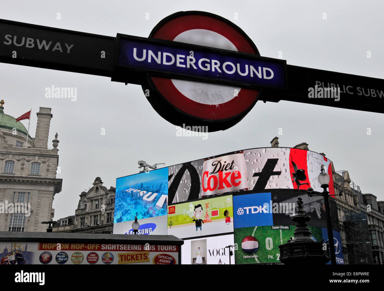 london undergound sign over the advertising in piccadilly circus ...