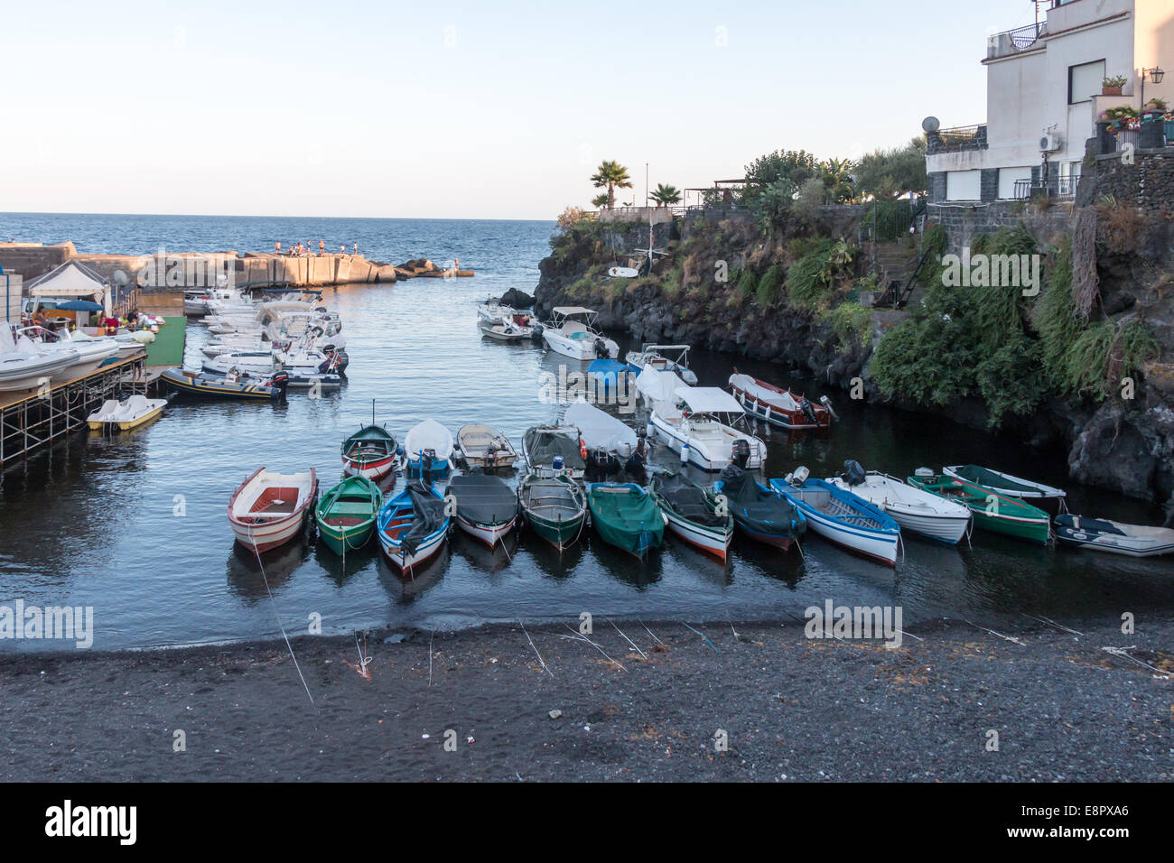 tourist pier with fishermen wod boat Stock Photo - Alamy