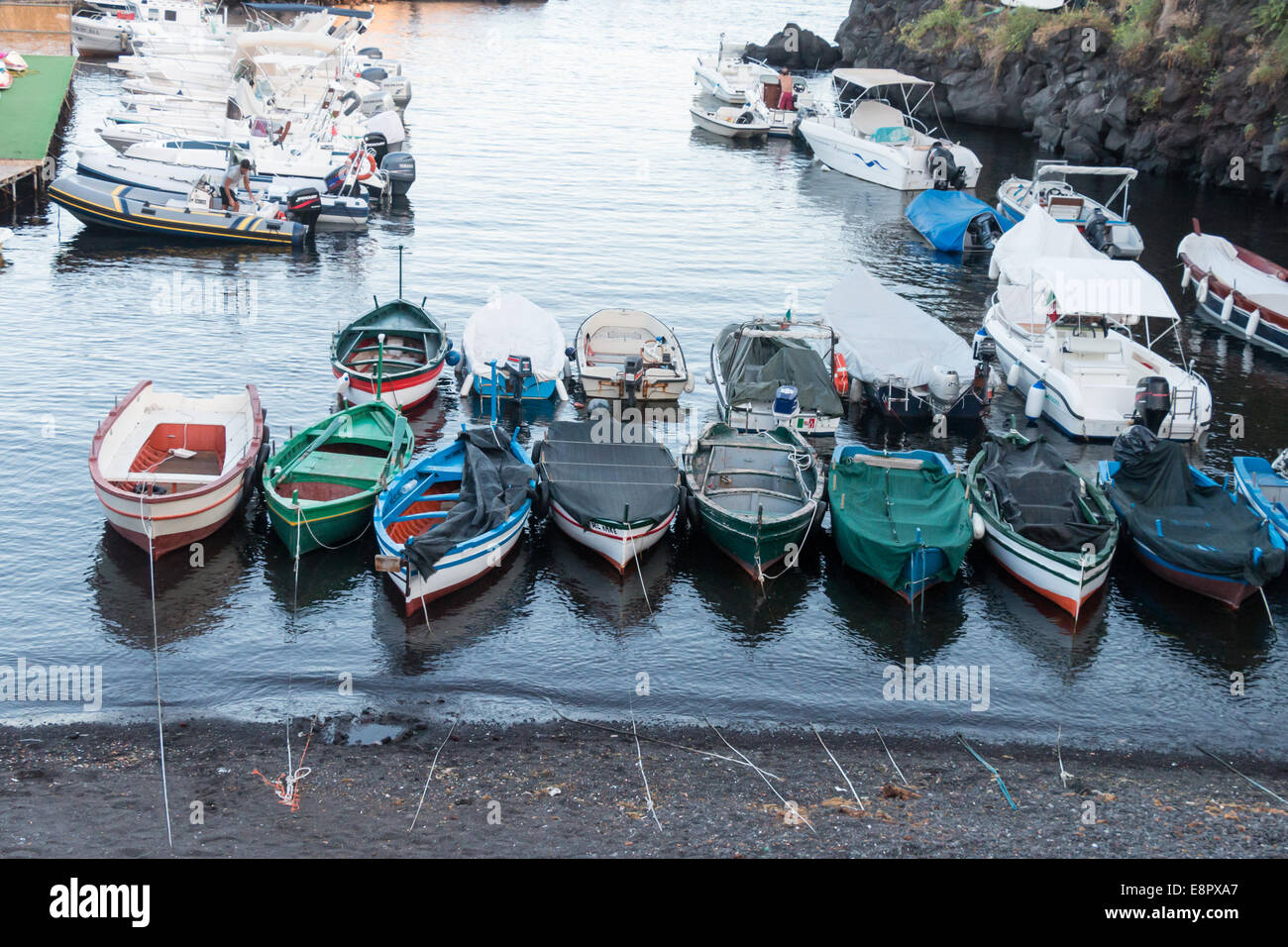 tourist pier with fishermen wod boat Stock Photo - Alamy