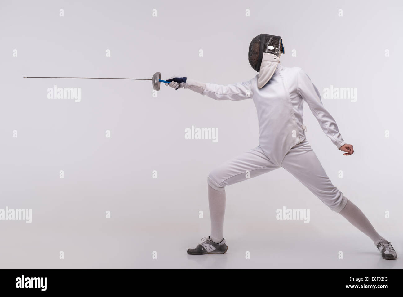 Young woman engaging in fencing Stock Photo - Alamy