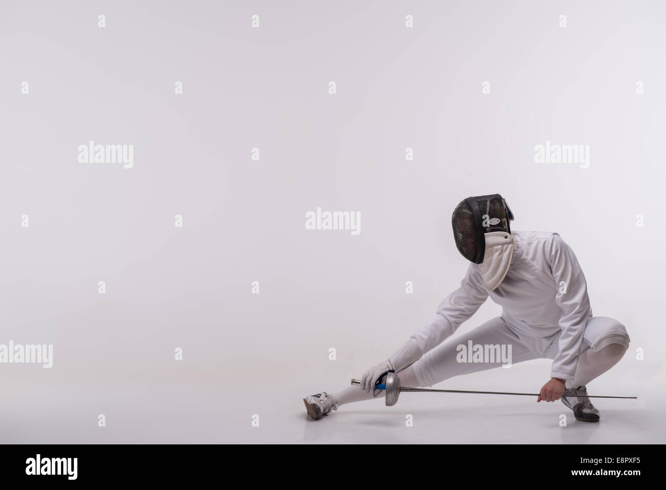 Young woman engaging in fencing Stock Photo - Alamy