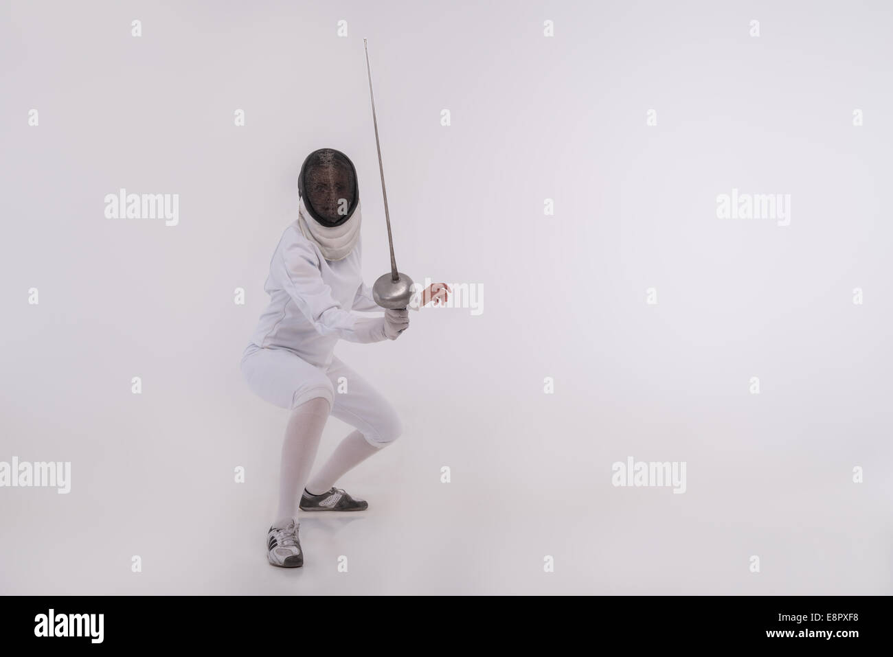 Young woman engaging in fencing Stock Photo - Alamy