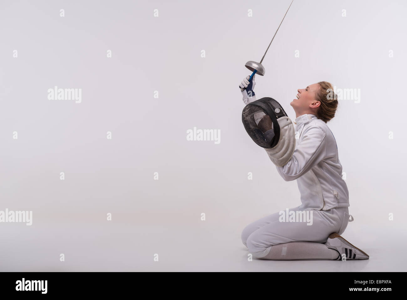 Young woman engaging in fencing Stock Photo - Alamy